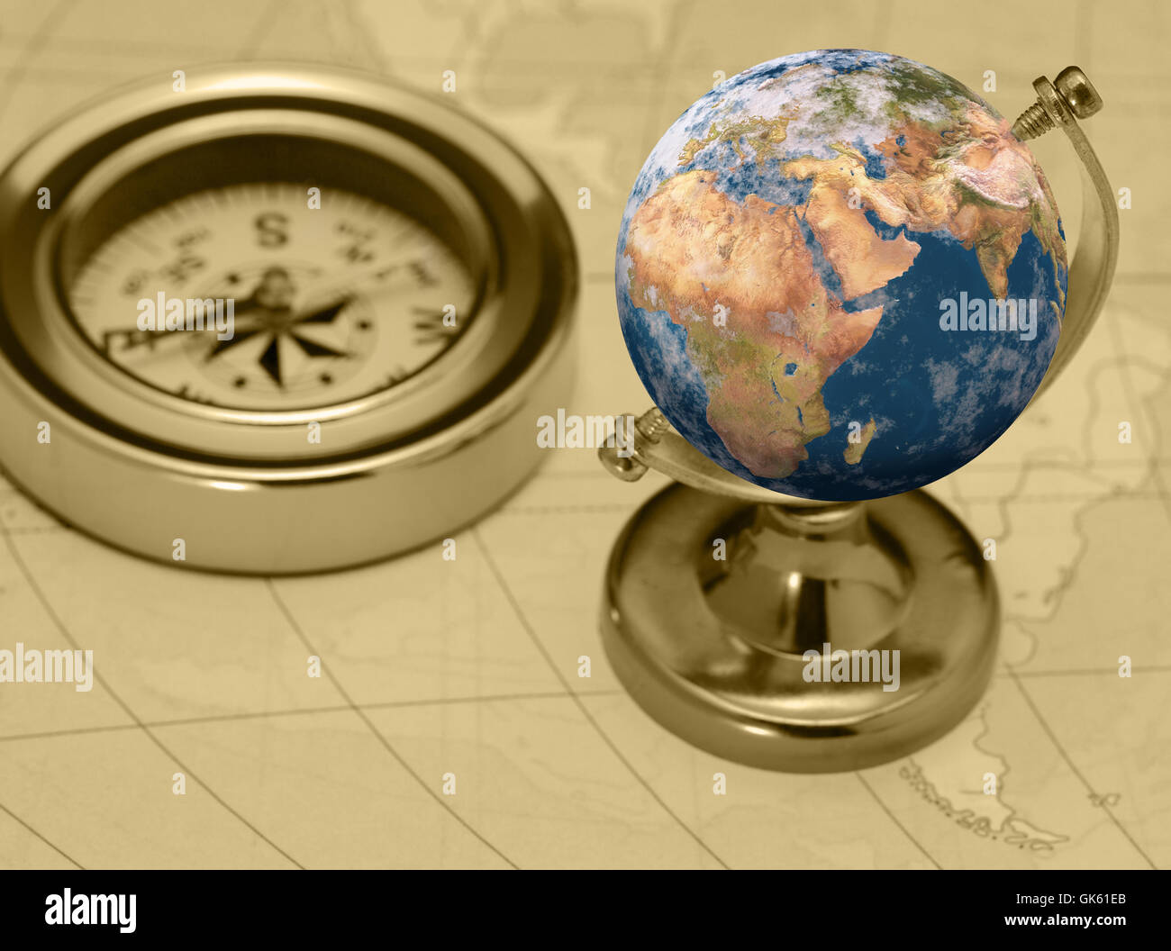 Ancient compass and earth Stock Photo - Alamy