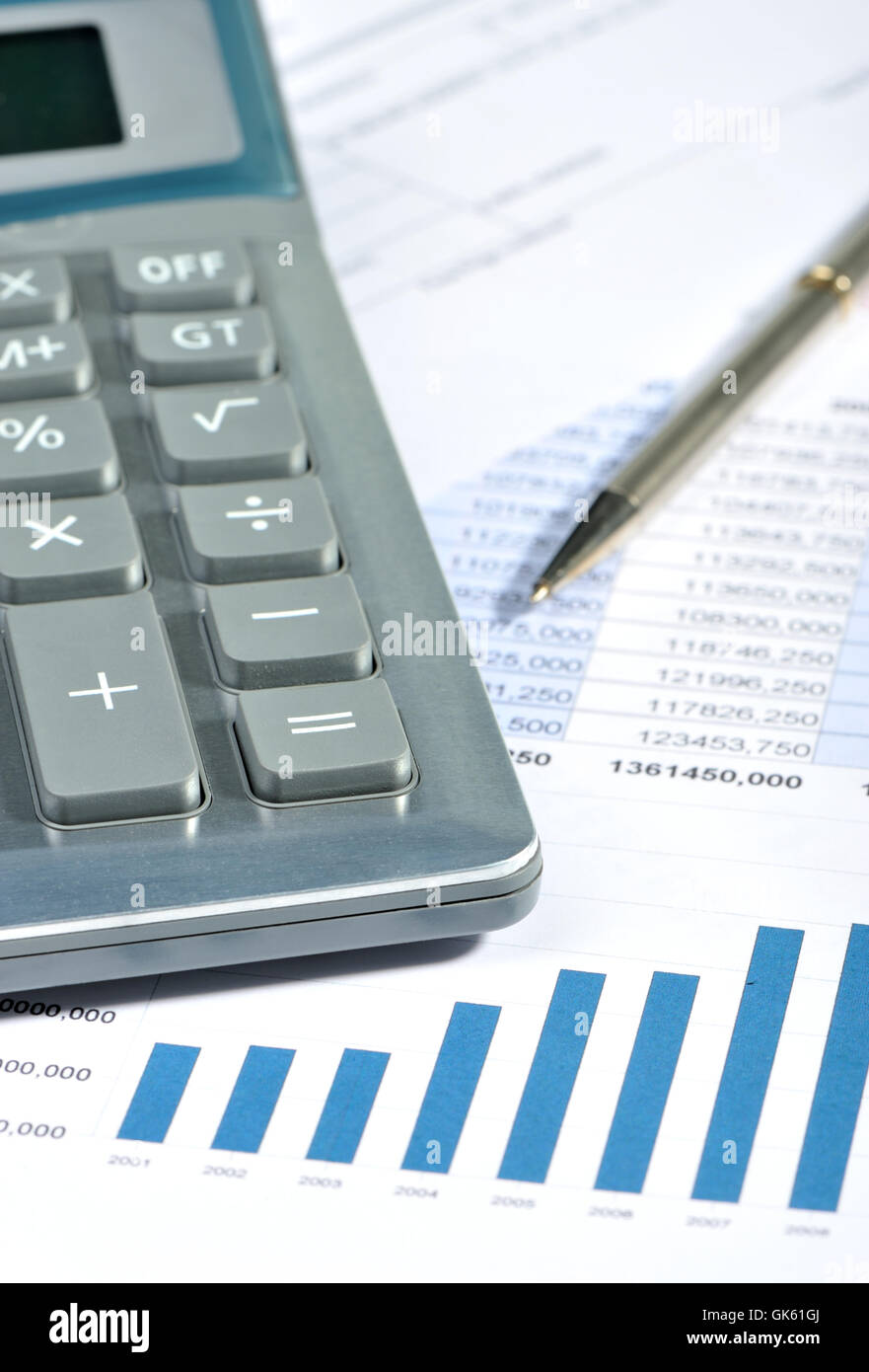 The calculator and the financial report Stock Photo - Alamy