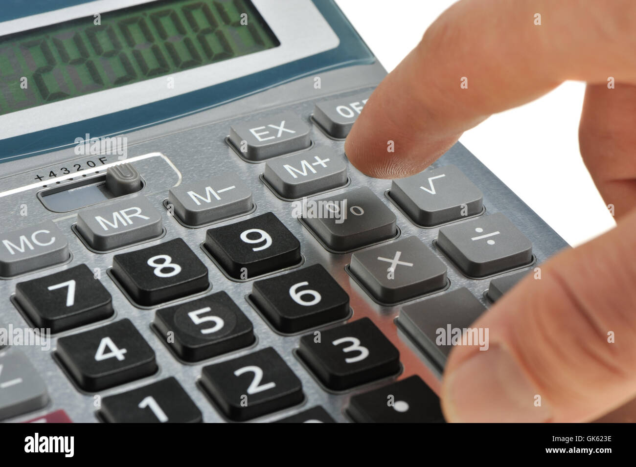 The calculator and a hand of the man Stock Photo - Alamy