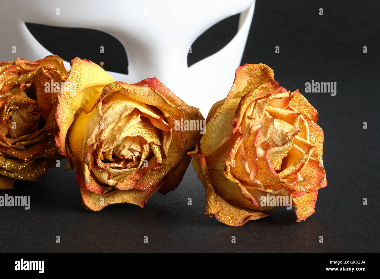 Venetian Mask And Roses Stock Photo - Alamy