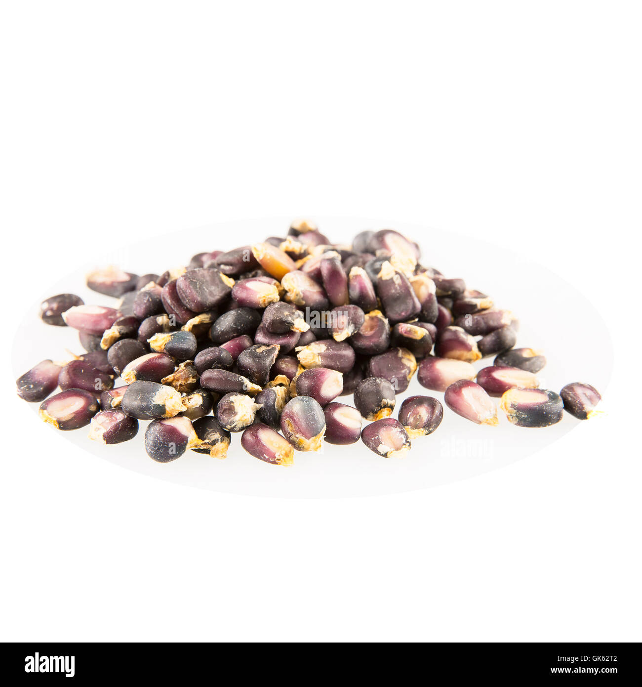 Pile of dried blue corn hominy isolated on white Stock Photo - Alamy