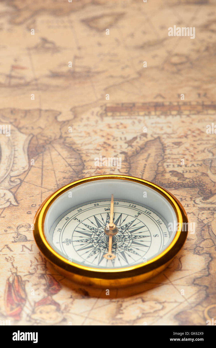 Old compass on ancient map Stock Photo - Alamy