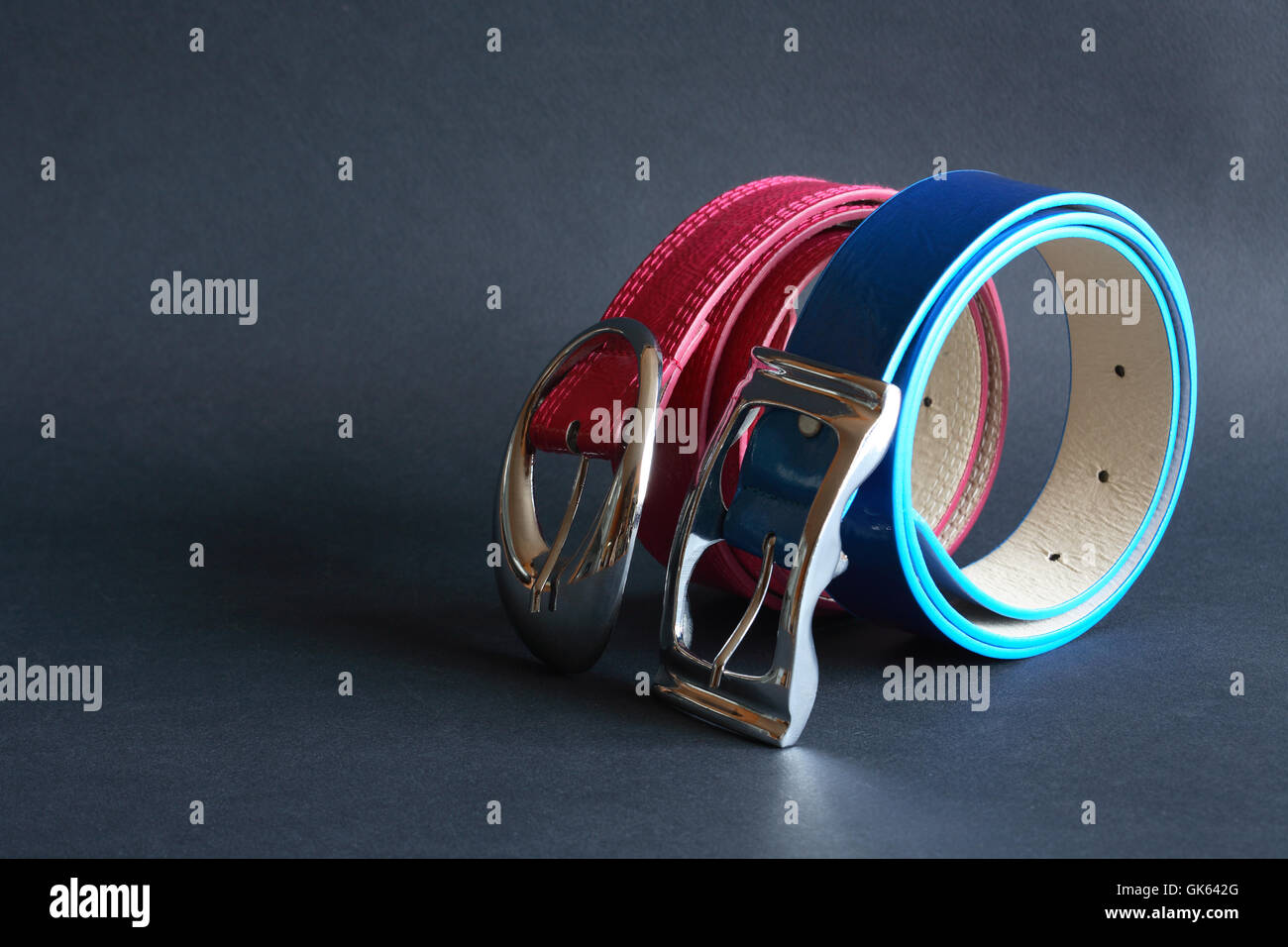 Two Belts On Dark Stock Photo - Alamy