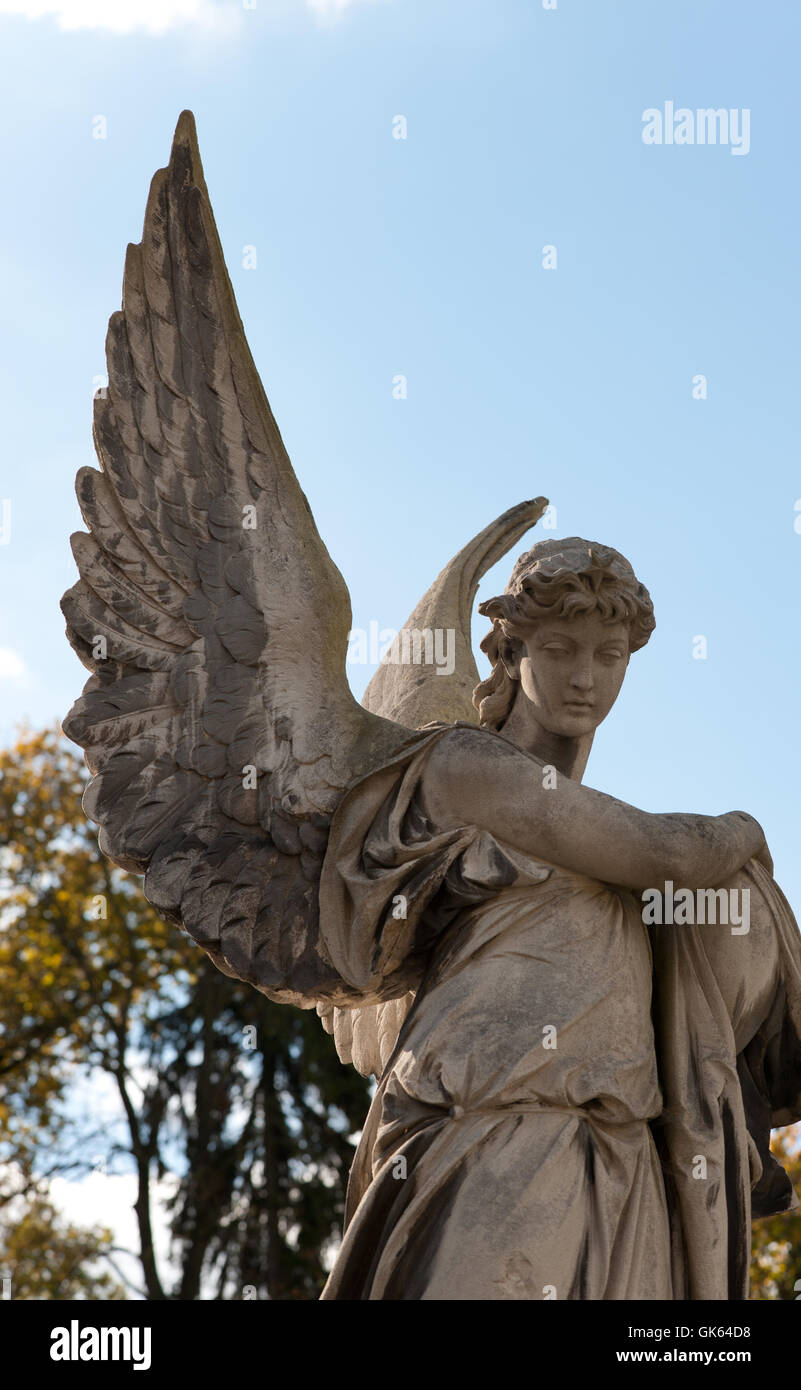 Monument to an angel on a cemetery Stock Photo - Alamy