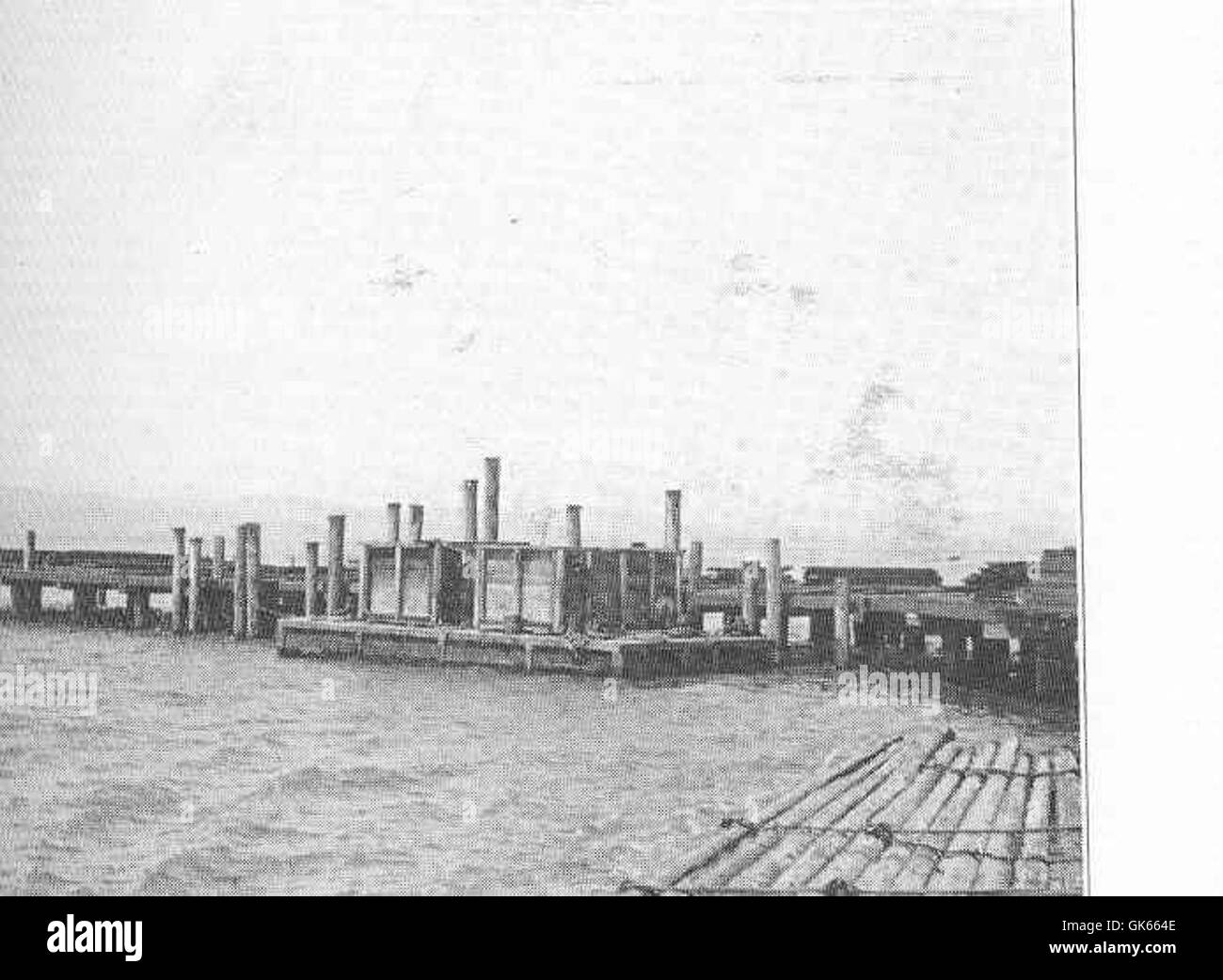 This image shows a creosoted pile raft, dogged and chained across a ...