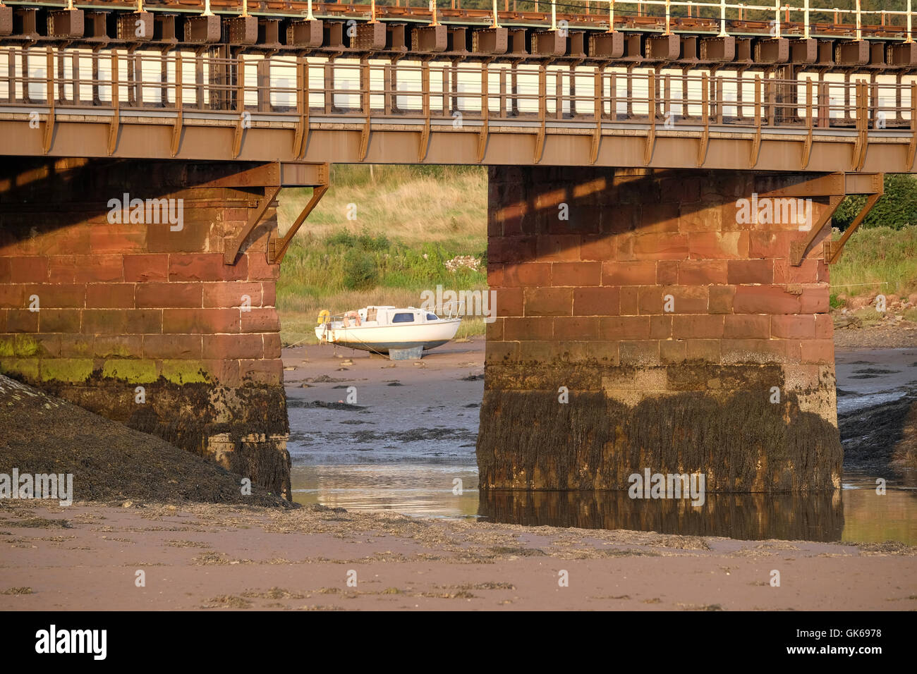 Boat seen through bridge Stock Photo - Alamy