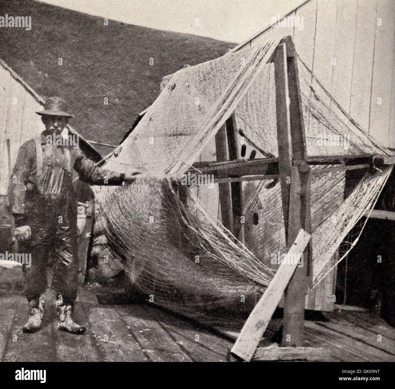 Cod gill nets used in fishing are shown on a drying reel, highlighting ...