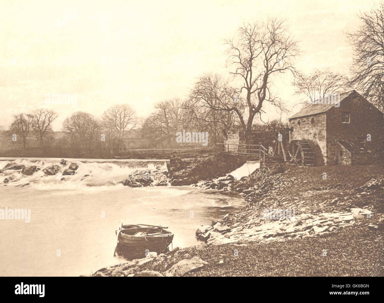 The River Eden flows through the village of Armathwaite in Cumbria ...
