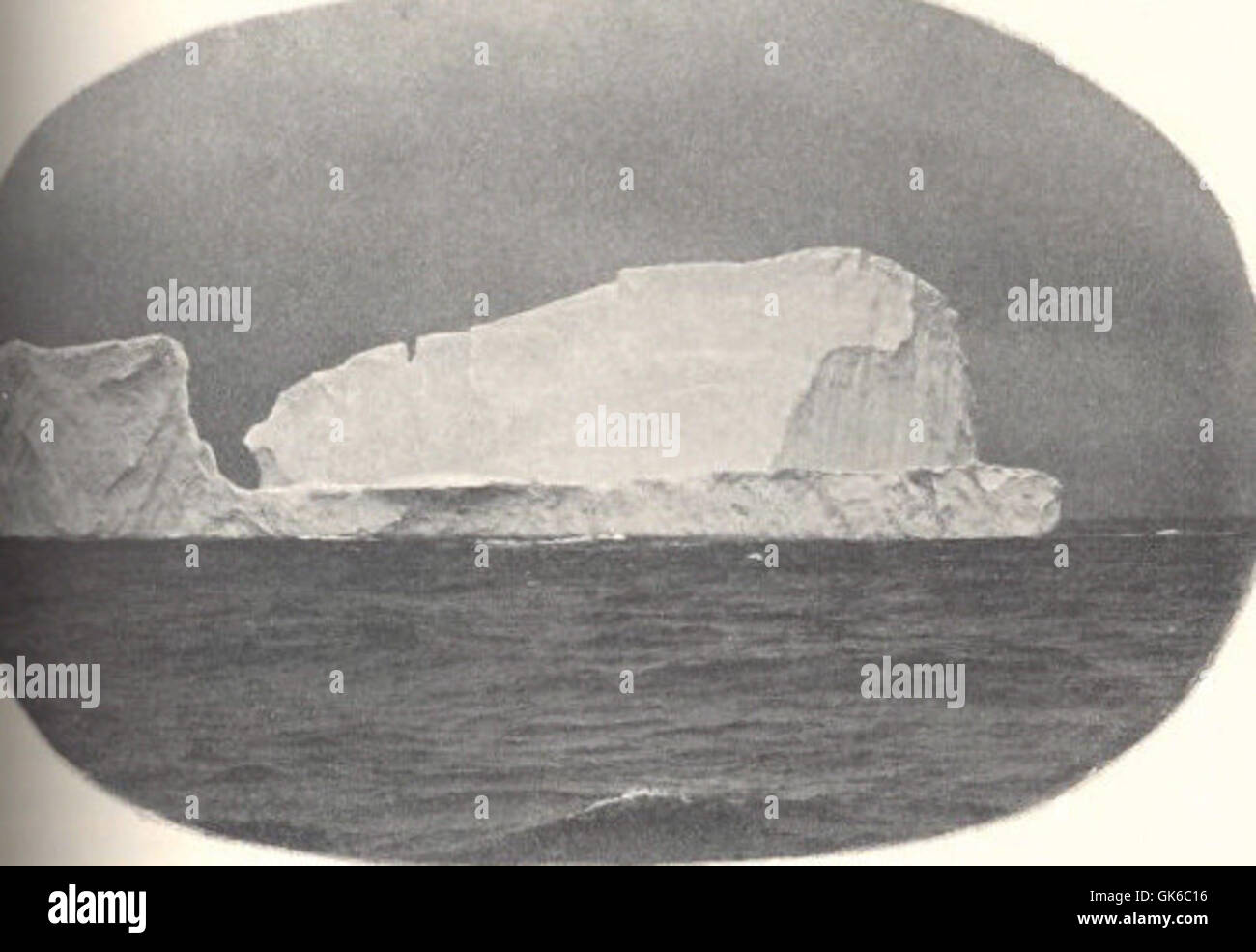 This image depicts two massive icebergs floating in the ocean, a ...