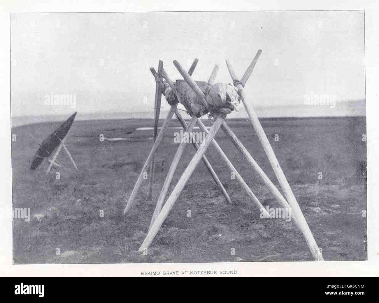 This image depicts an Eskimo grave located at Kotzebue Sound, Alaska ...