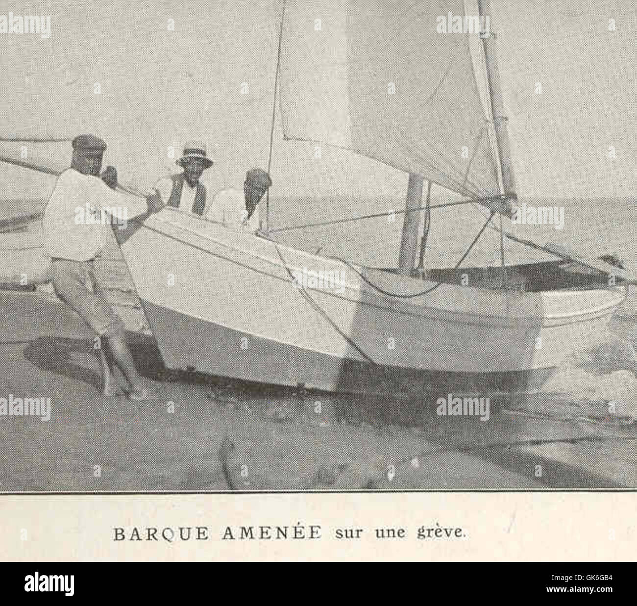 The Barque Amenee, a sailing ship, is shown aground on a beach (grève ...