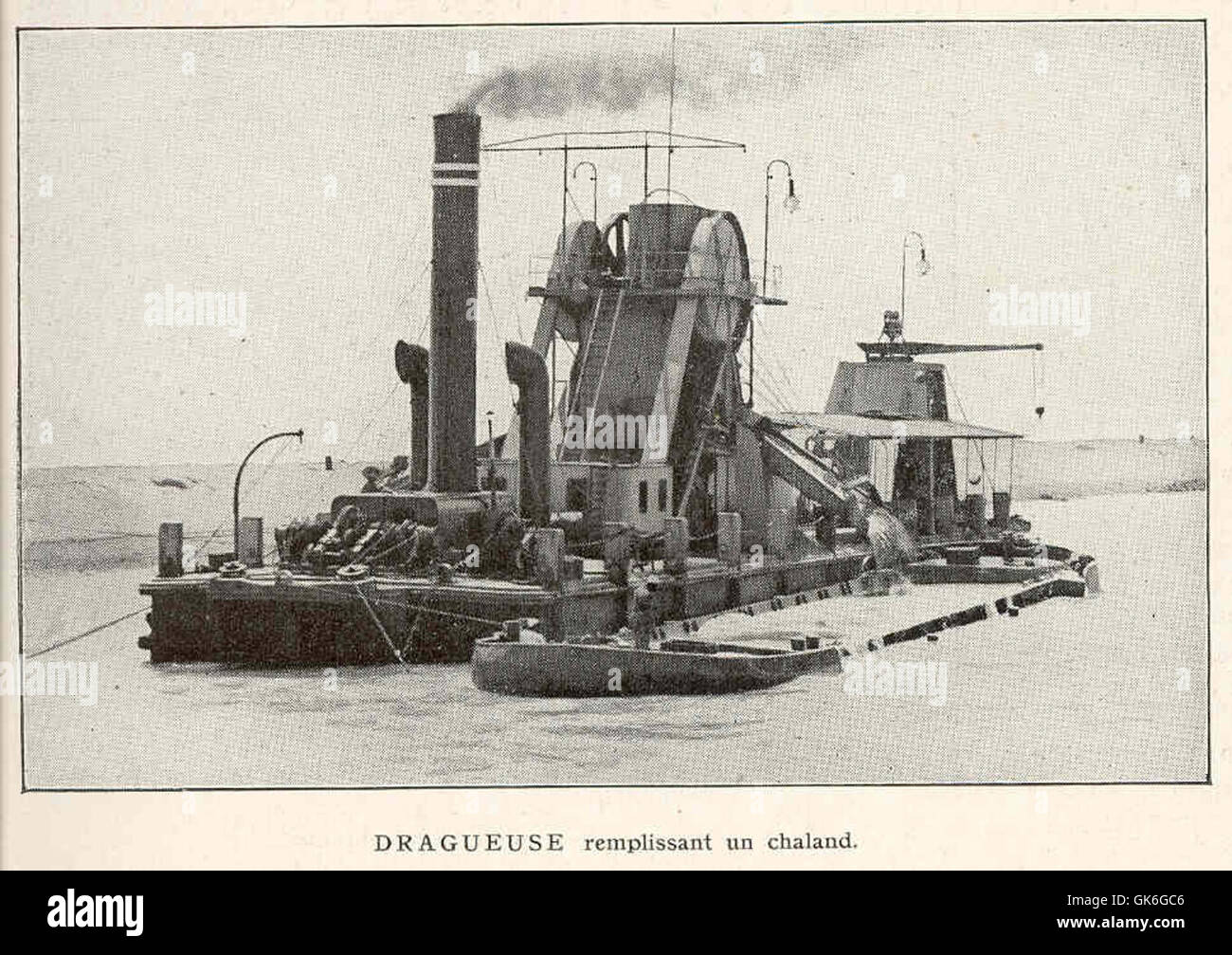 A dragger filling a barge represents a fishing vessel engaged in ...
