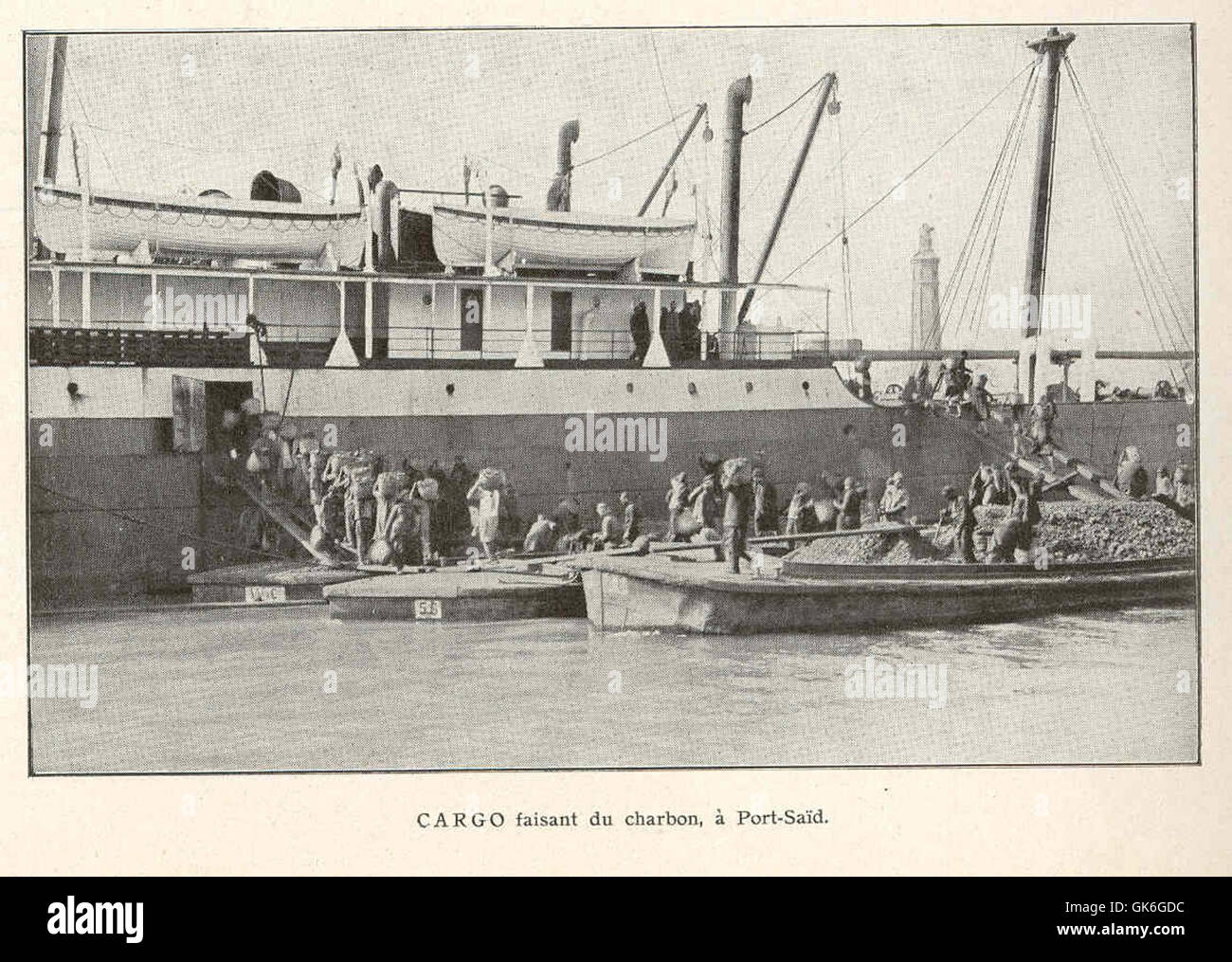 This image depicts coal cargo being handled at Port-Said, an important ...