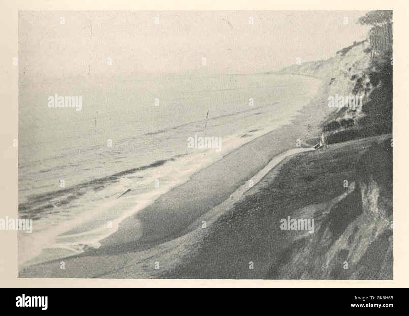 This photograph captures the natural phenomenon of sand drifting along ...