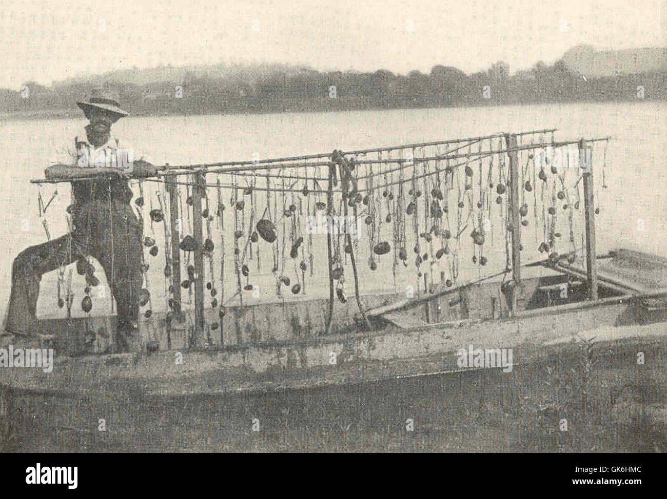 This setup for mussel harvesting includes a john boat, bars with ...