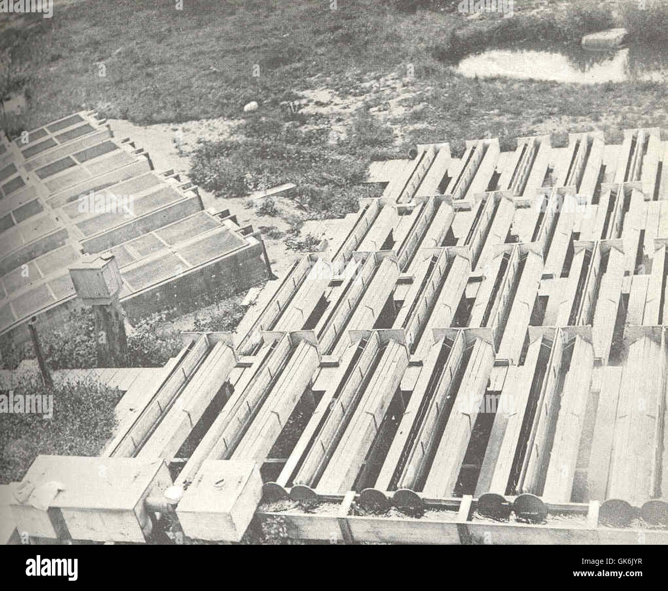 A photograph of outdoor troughs at Craig Brook, showing wooden troughs ...
