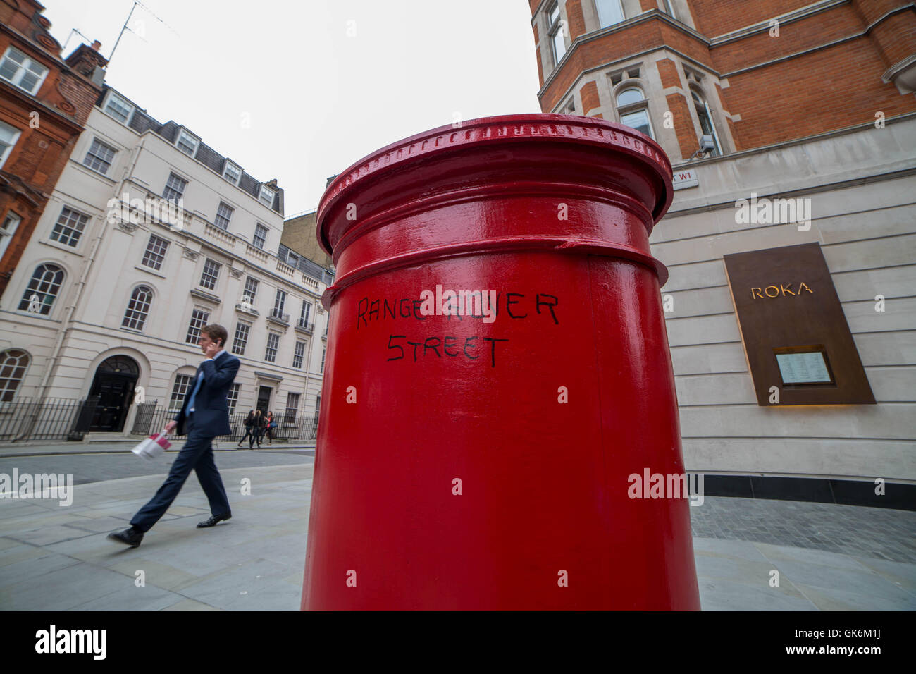 A red post box with 'Range Rover Street' graffiti in London W1 area ...
