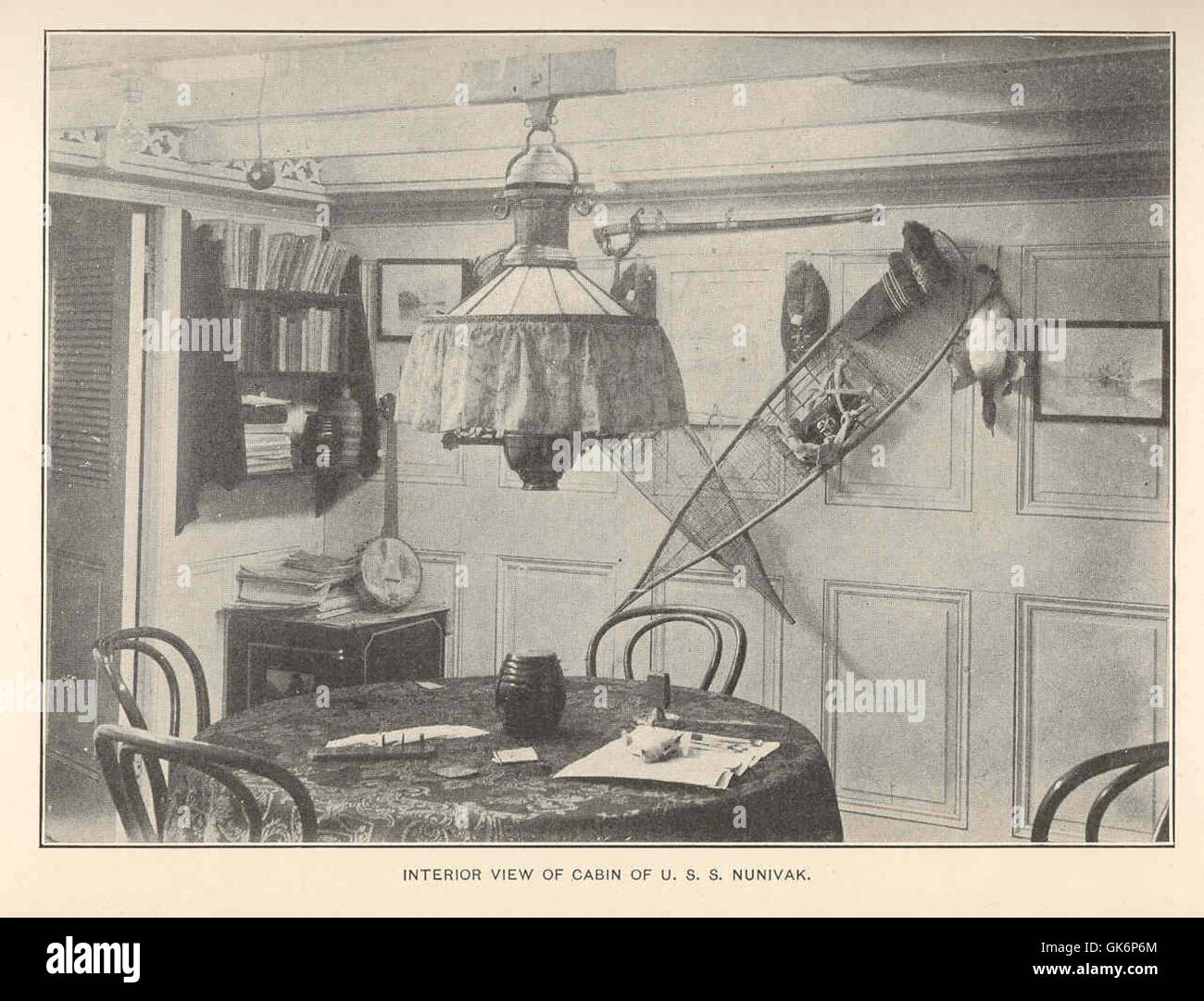 The interior of the U.S.S. Nunivak's cabin showcases the living and ...