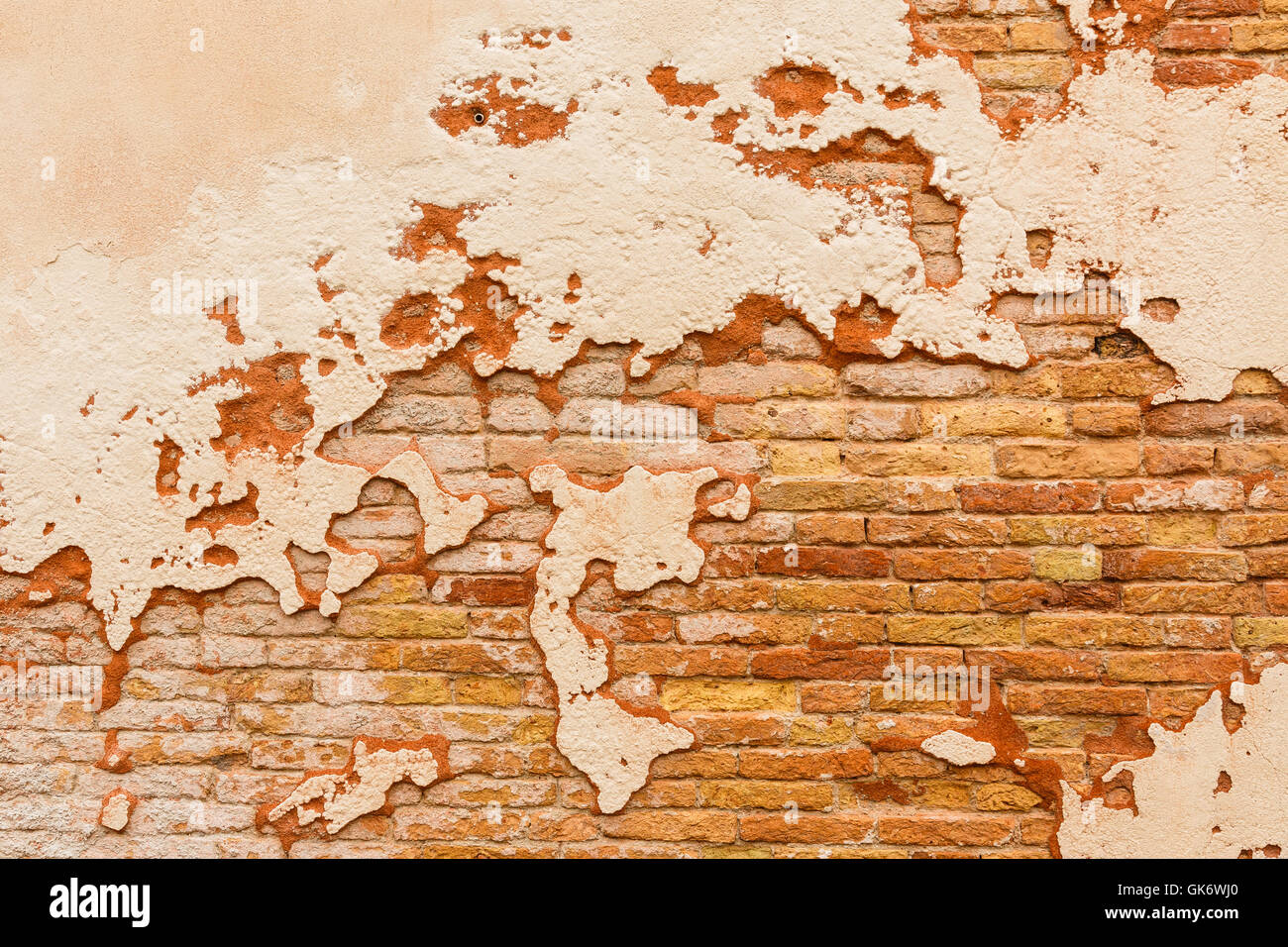 Texture of an old brick wall with broken plaster Stock Photo - Alamy