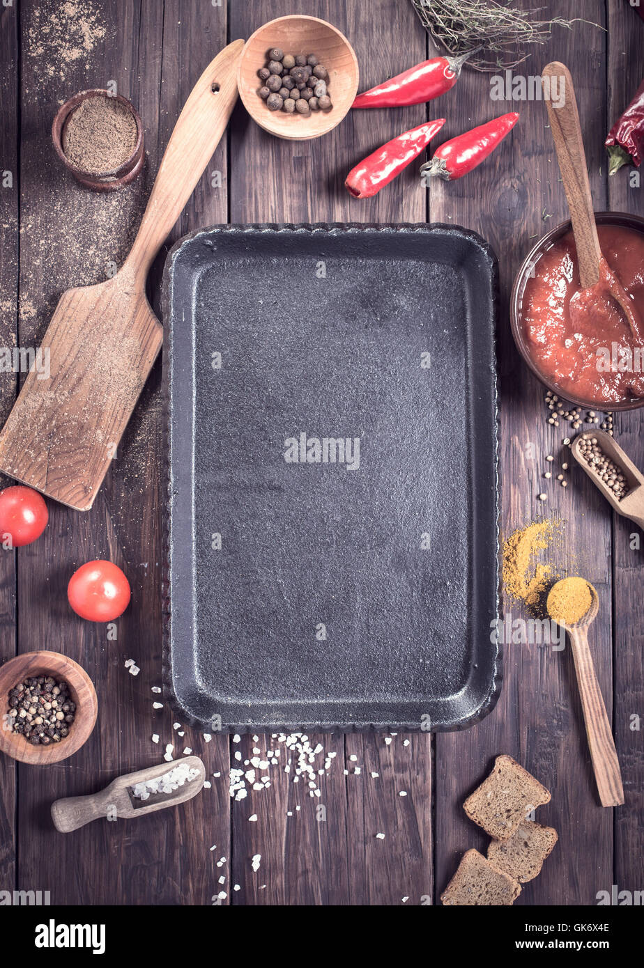 Empty serving pan and various cooking ingredients Stock Photo - Alamy