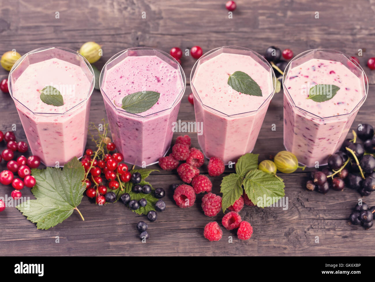 Various fresh berries smoothies top view Stock Photo - Alamy