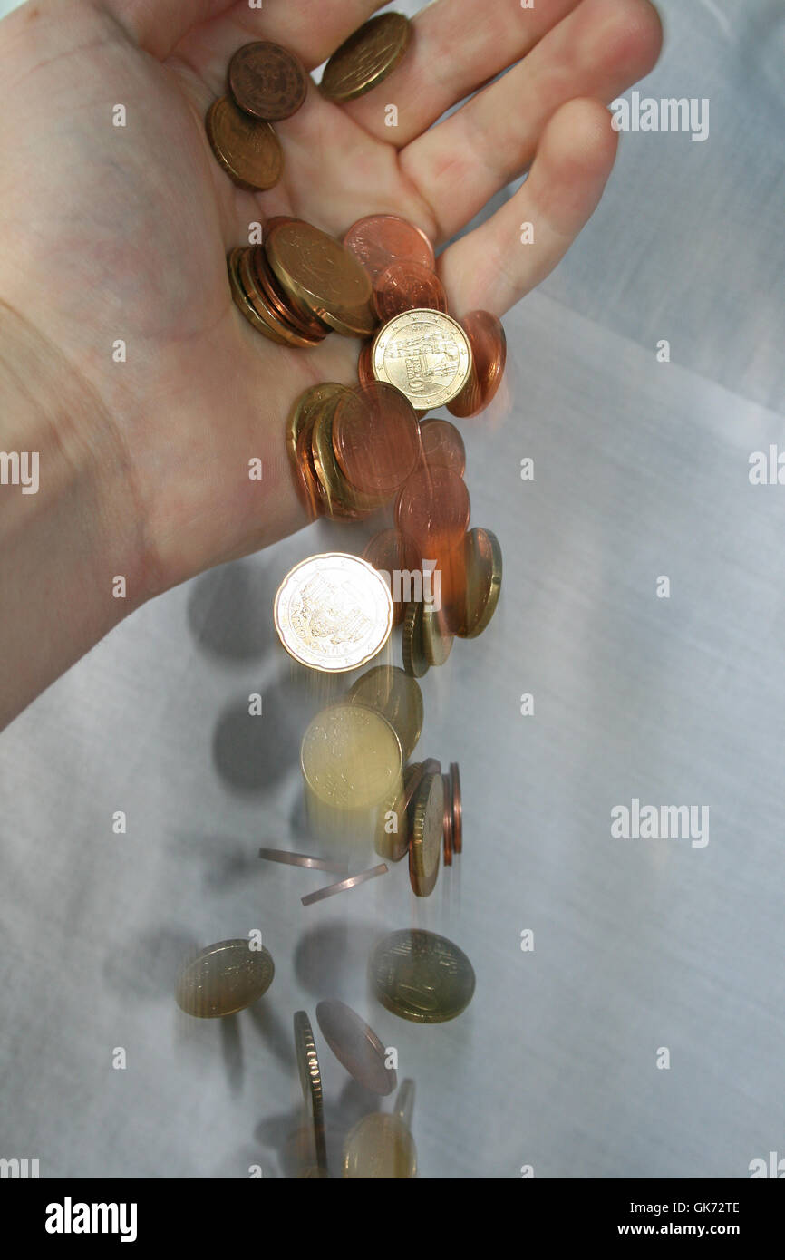 hand coin money-move Stock Photo - Alamy