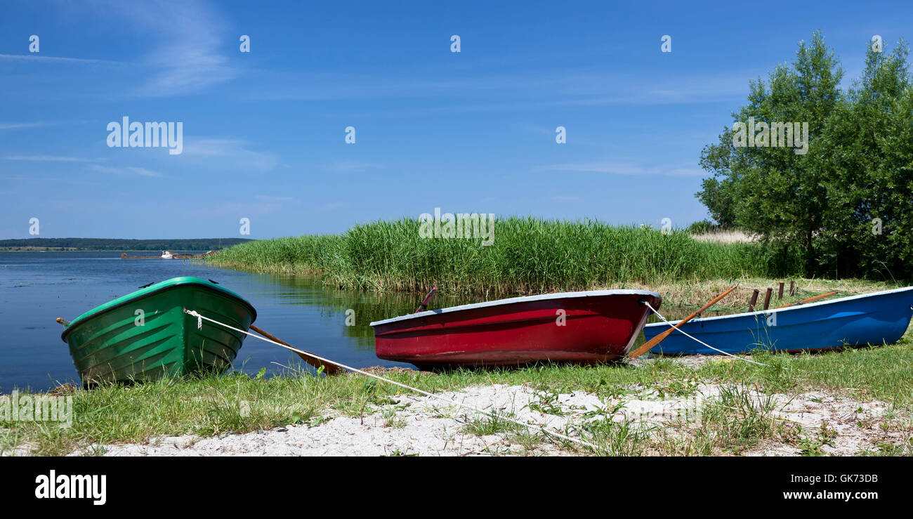 three rowboats on shore Stock Photo - Alamy