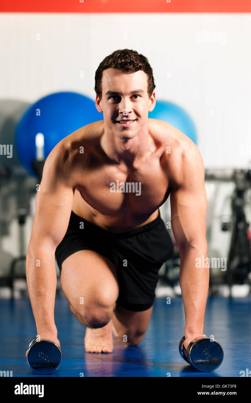 man doing pushups in the gym Stock Photo - Alamy