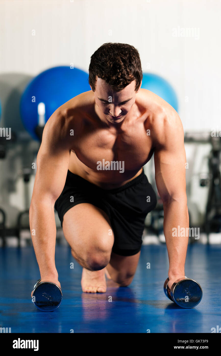man doing pushups in gym Stock Photo - Alamy