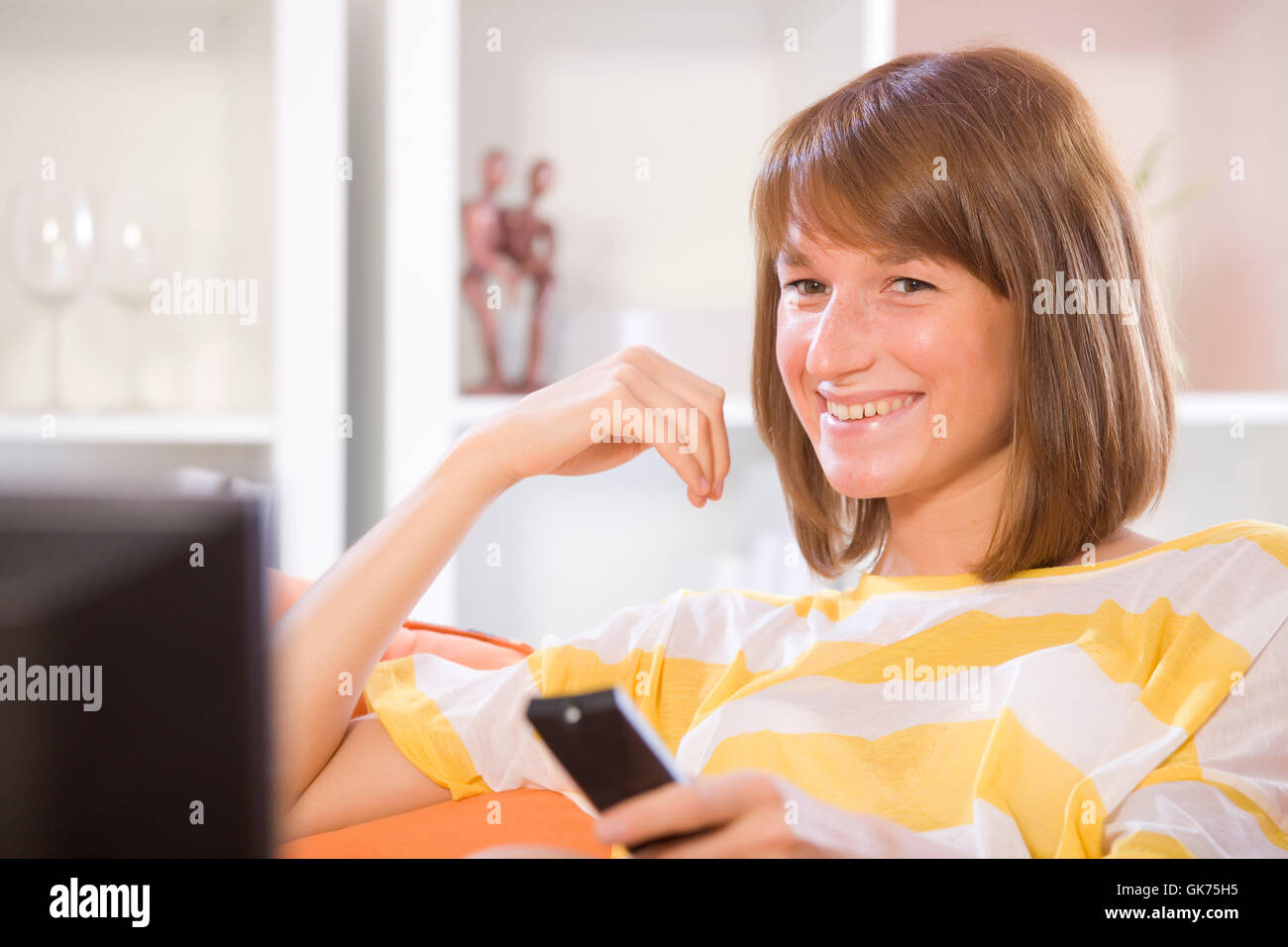 woman room remote Stock Photo - Alamy