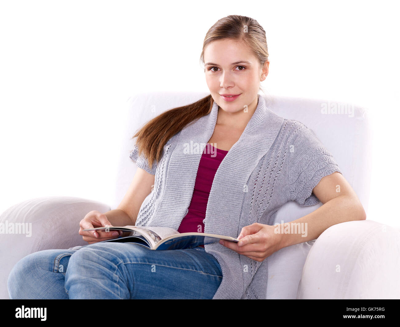 young woman reads magazine Stock Photo - Alamy