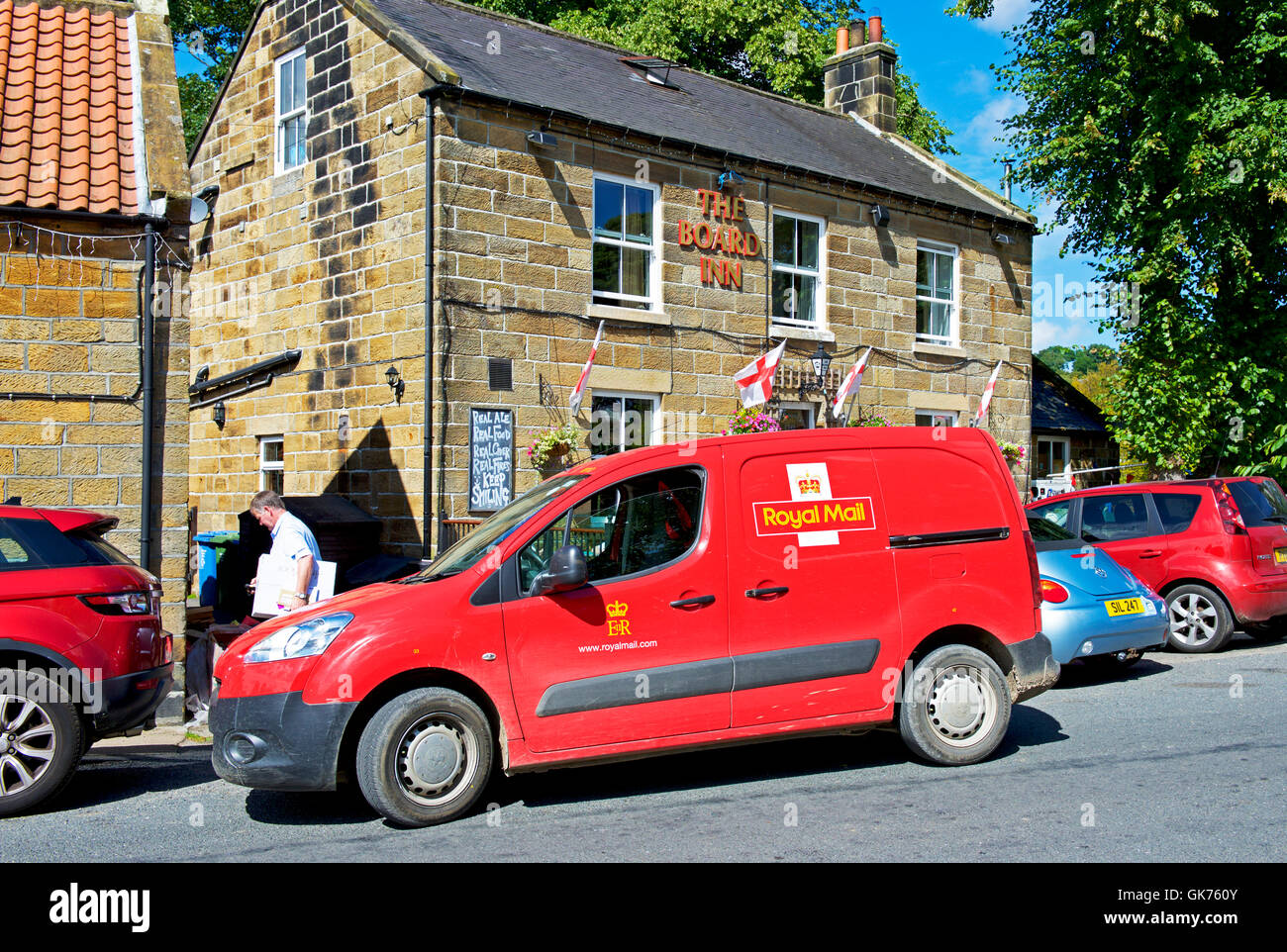 Postman and Royal Mail van outside the Board Inn, Lealholm, North ...
