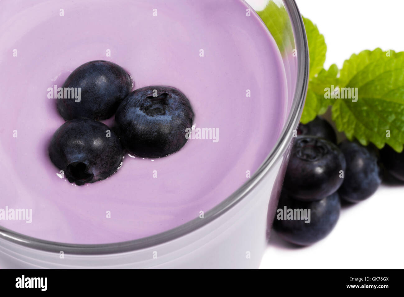 blueberries on blueberry milkshake next Stock Photo - Alamy