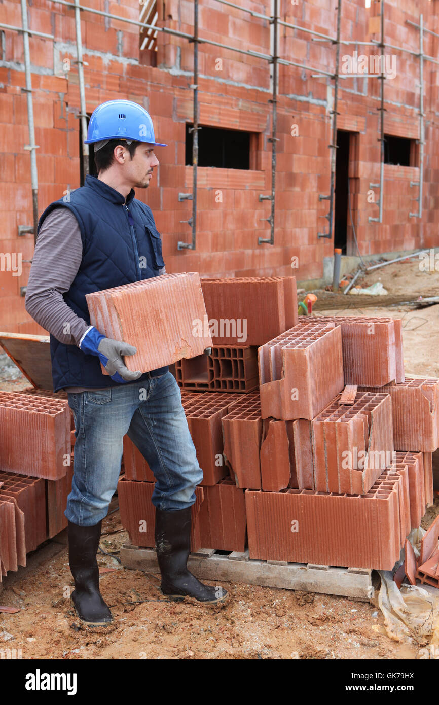Bricklayer builder lays bricks blocks hi-res stock photography and ...