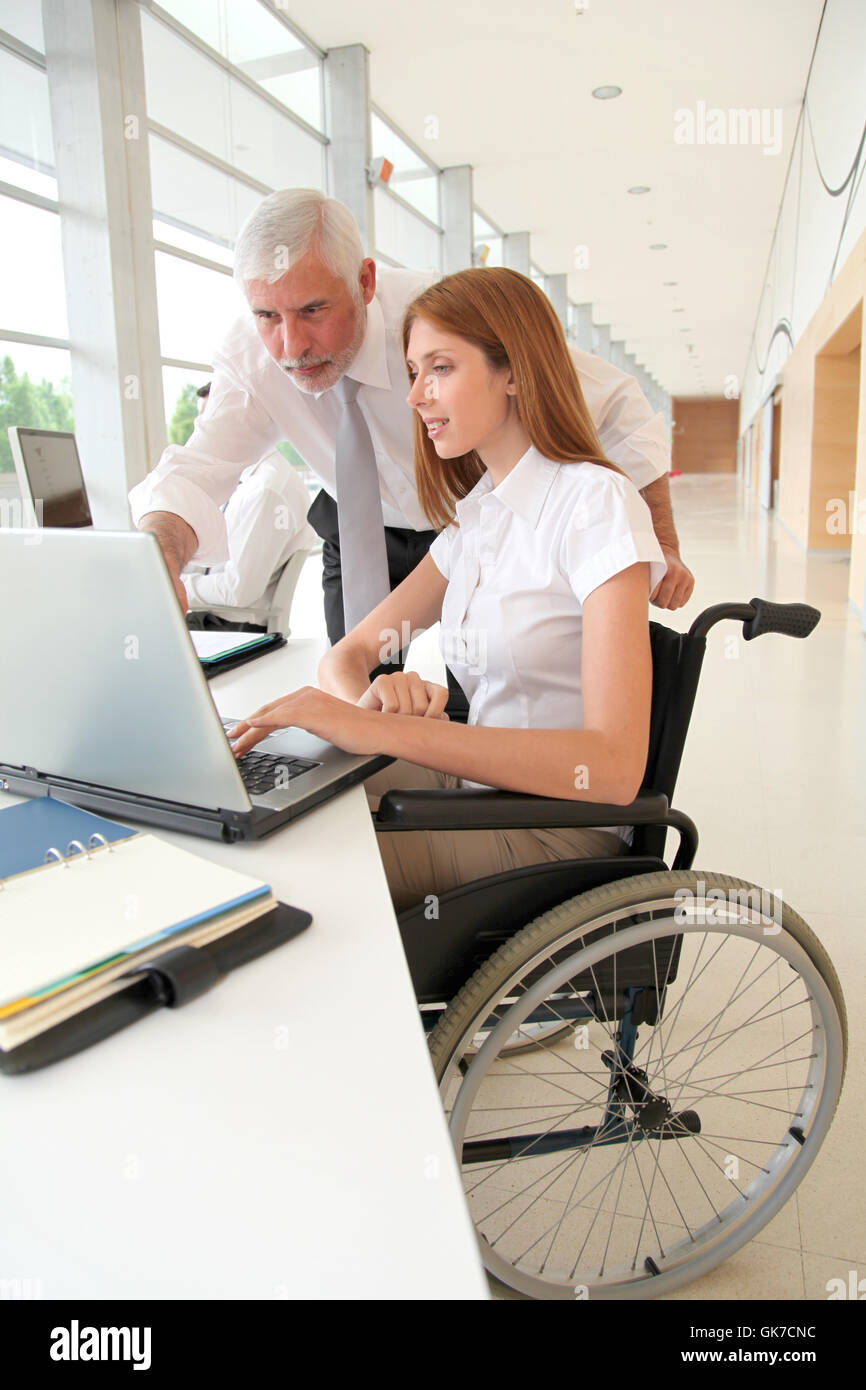 woman wheelchair office Stock Photo - Alamy