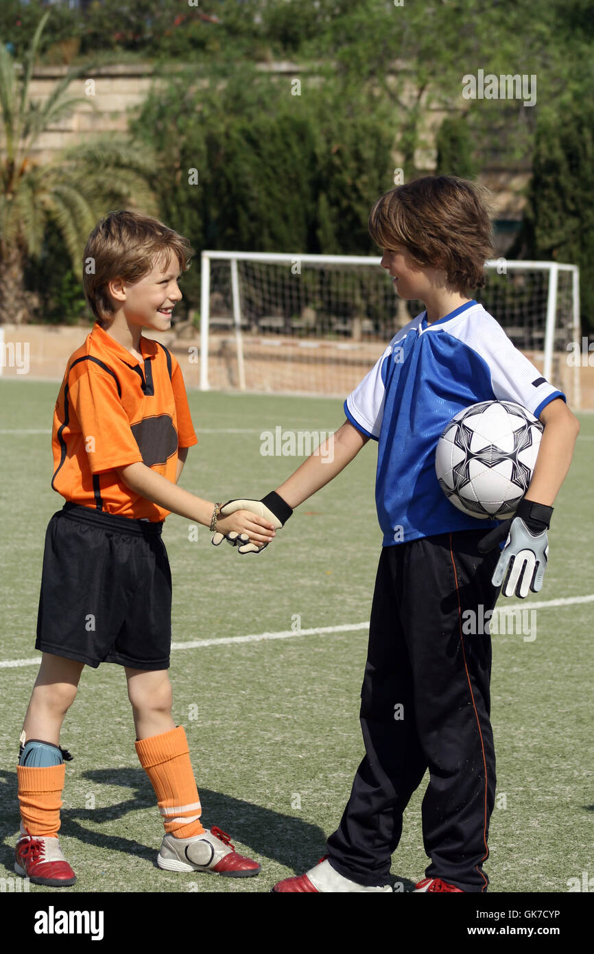 Children soccer ball handshake hi-res stock photography and images - Alamy
