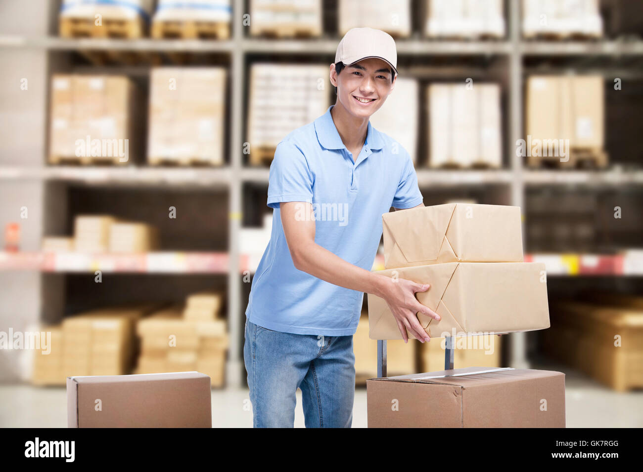 Staff handling cargo warehouse Stock Photo - Alamy
