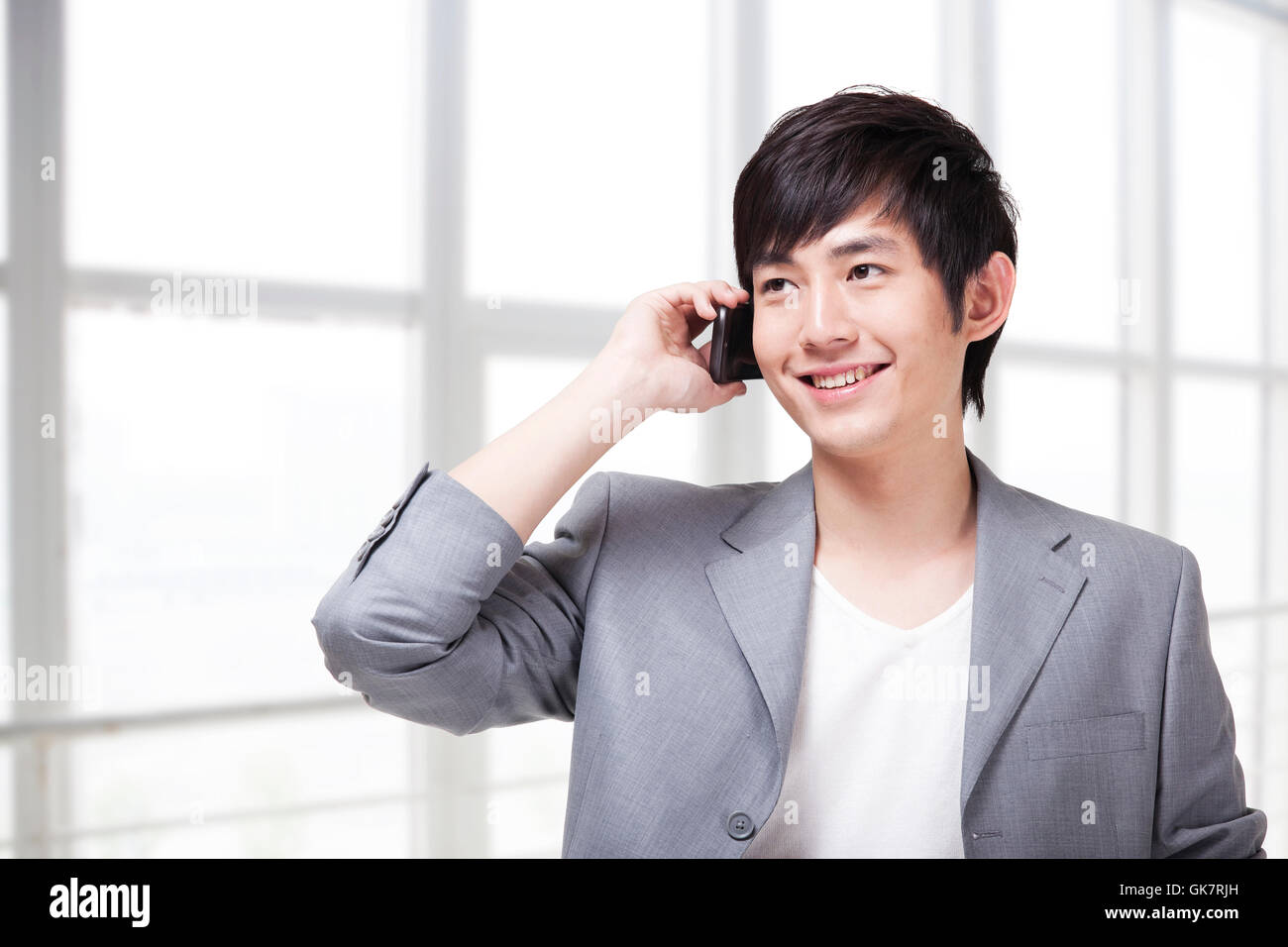 Young business man calling Stock Photo - Alamy