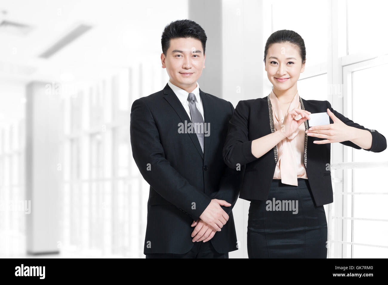 Business people showing Card Stock Photo - Alamy