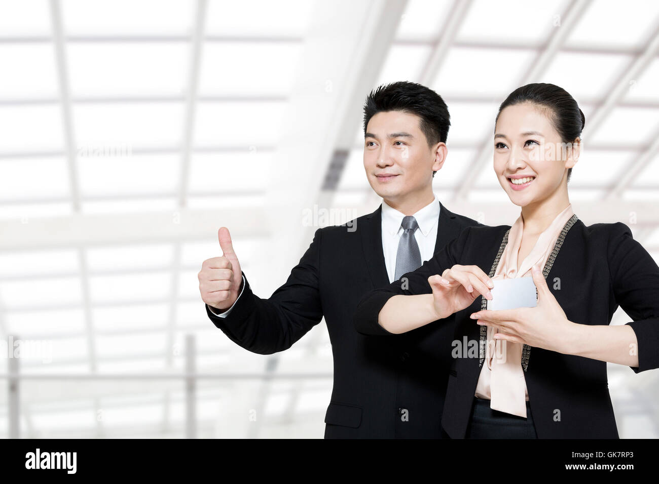 Business people showing Card Stock Photo - Alamy