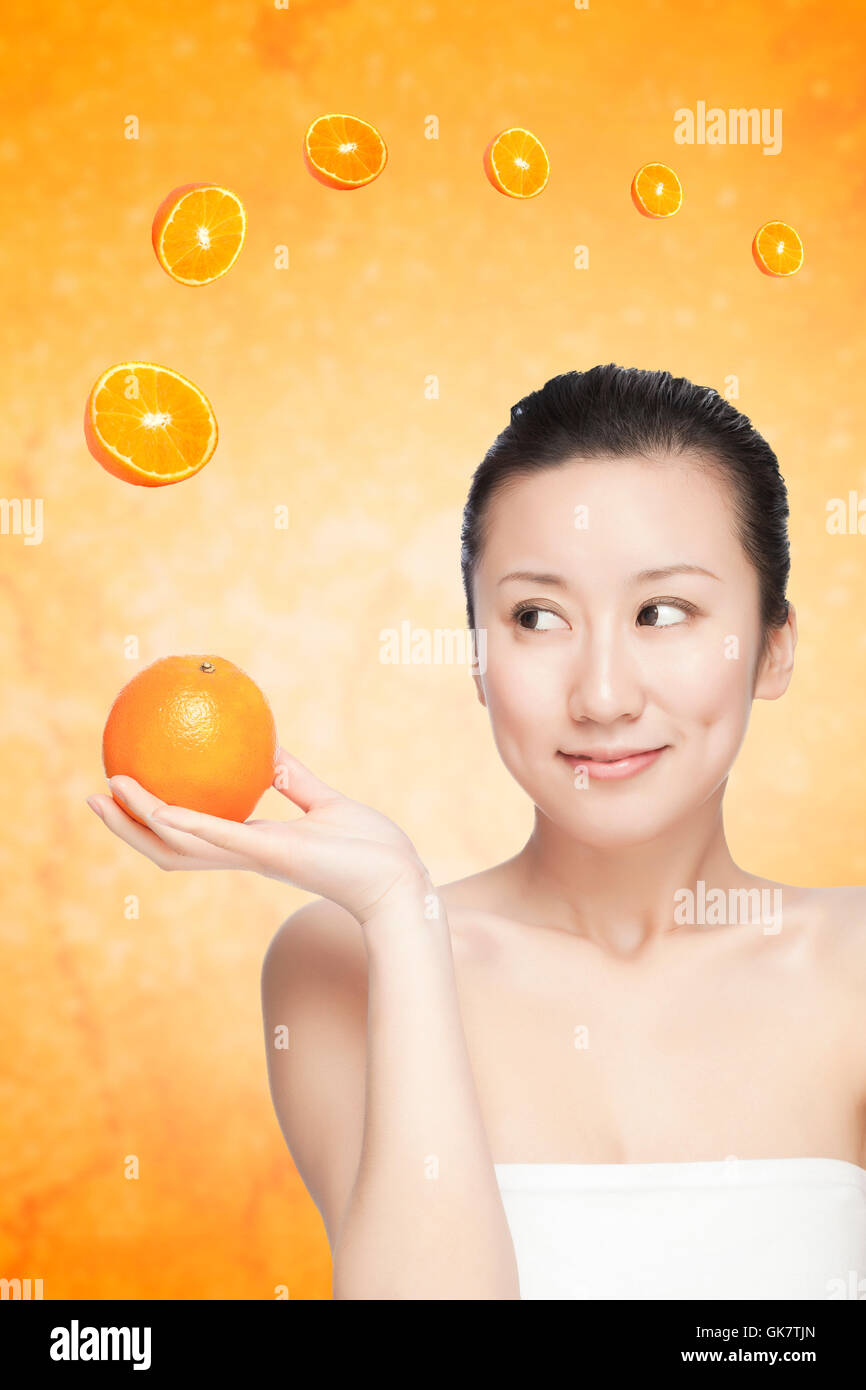 Studio shot Young woman and fruit Stock Photo - Alamy