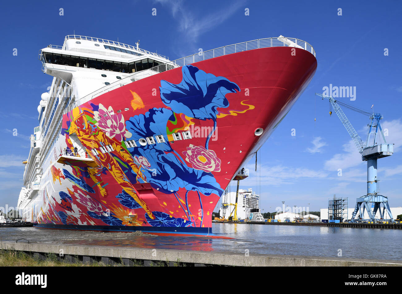 The youngest cruise ship, "Genting Dream" is towed from the covered ...