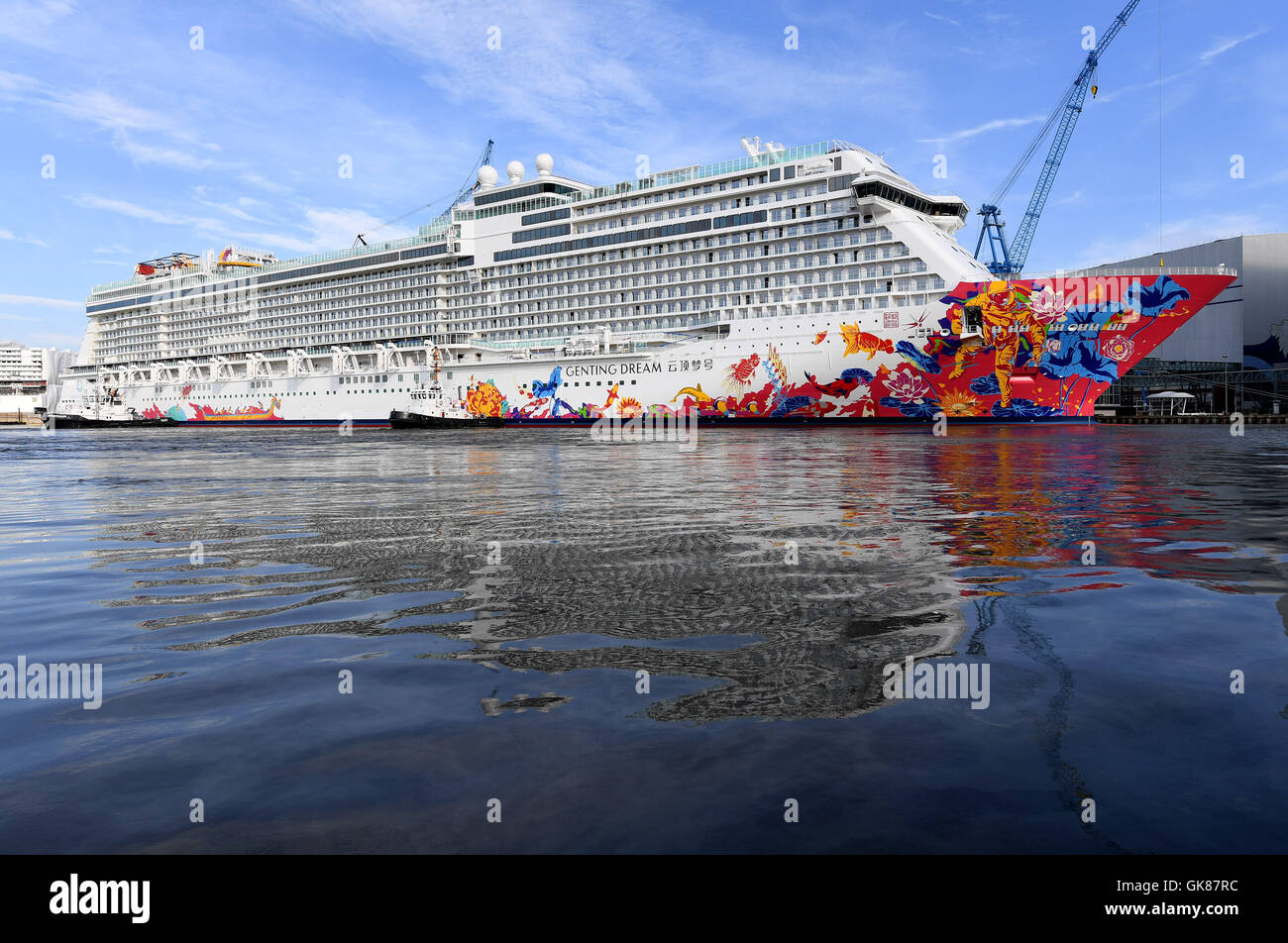 The youngest cruise ship, "Genting Dream" is towed from the covered ...