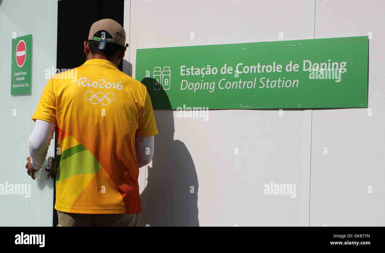 Rio de Janeiro, Brazil. 19th Aug, 2016. A man opens a door of the ...