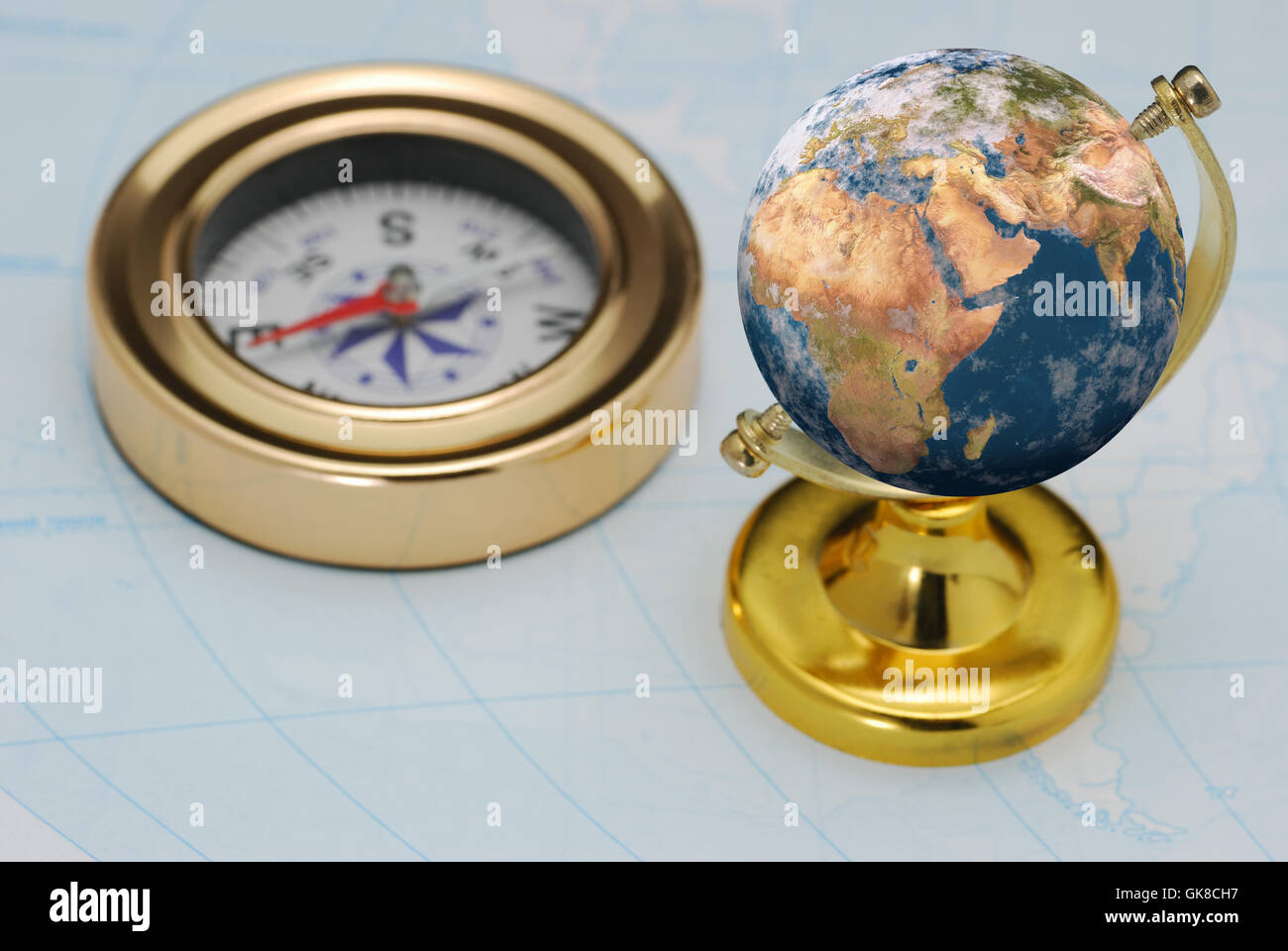 Compass and earth Stock Photo - Alamy