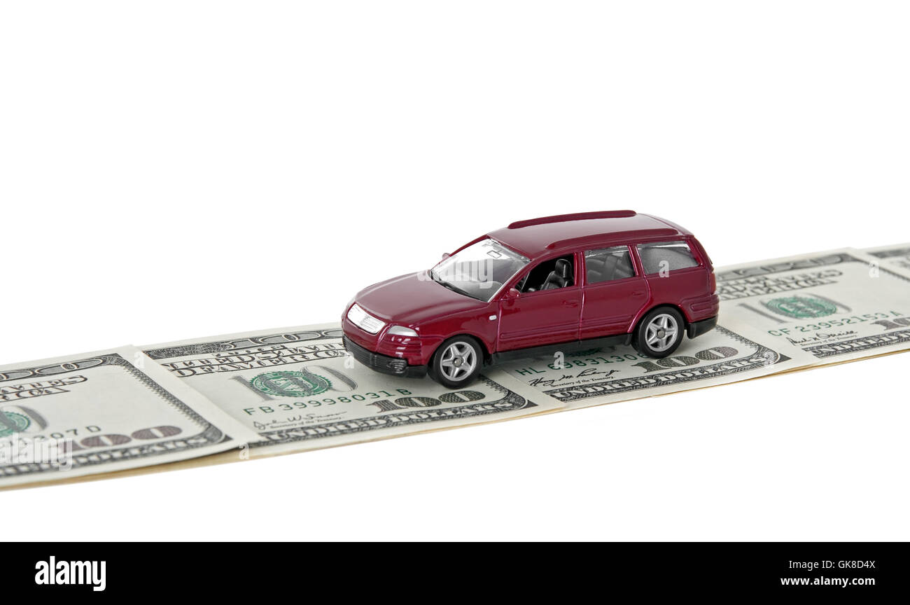 Red car on money road Stock Photo - Alamy