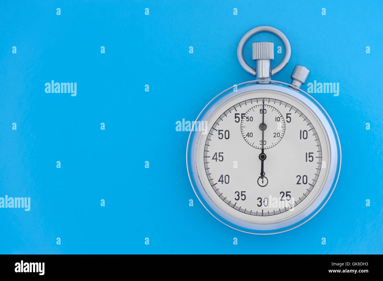 Stopwatch on blue background Stock Photo - Alamy
