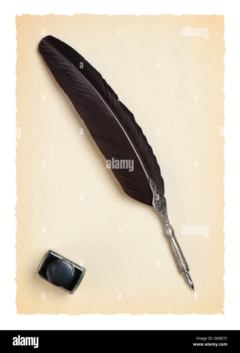 Feather quill and inkwell on an old paper Stock Photo - Alamy