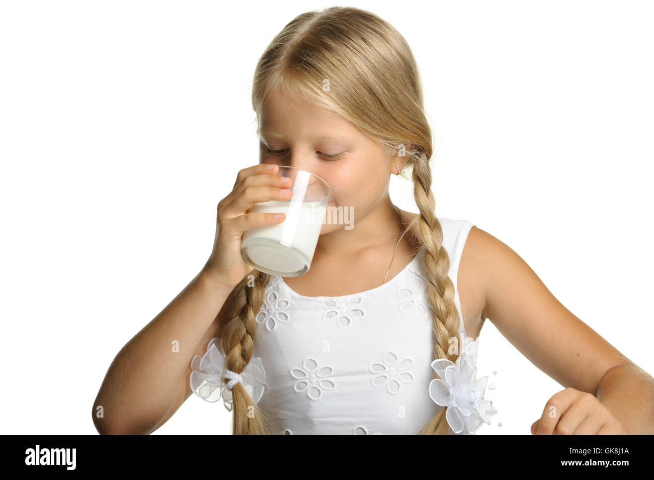 The pretty girl with a glass of milk Stock Photo - Alamy