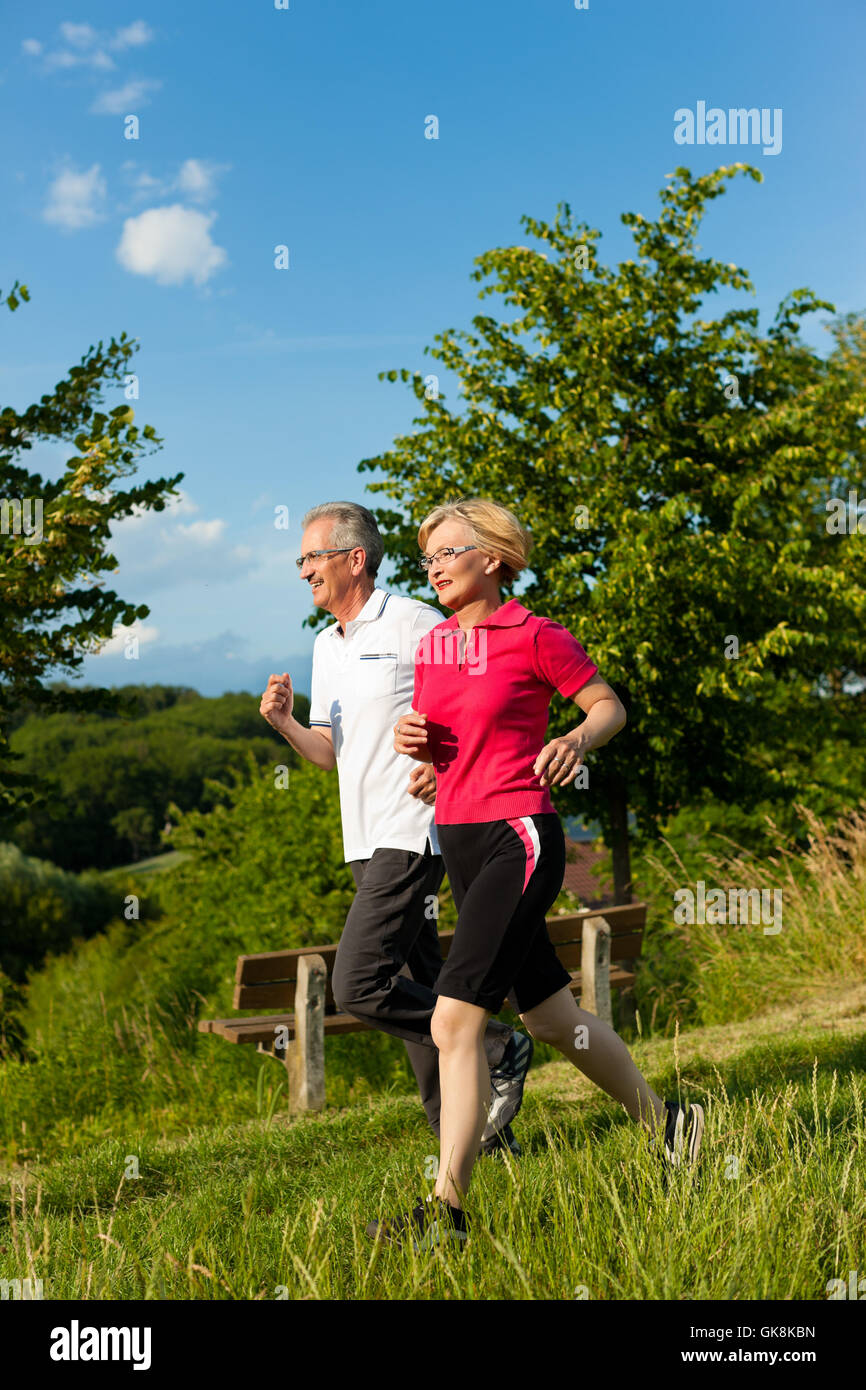 elderly couple jogging Stock Photo - Alamy